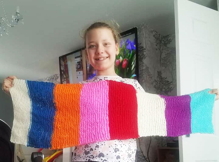 Creative schoolgirl who knitted rainbow scarf in support of NHS ...